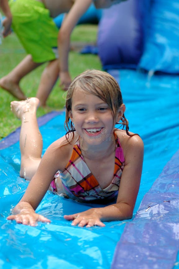 Slip and Slide stock photo. Image of children, cool, happy - 2528404