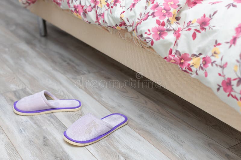 Slippers Near the Bed on Which the Person Sleeps. Stock Image - Image ...