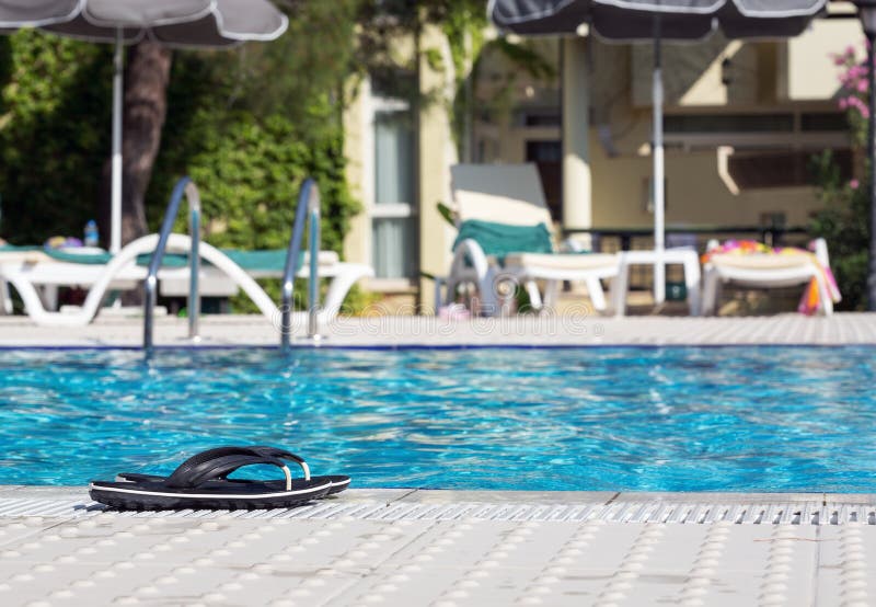 Slippers Near the Swimming Pool Stock Image - Image of leisure, heat ...