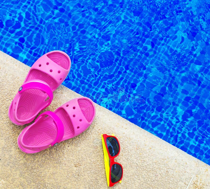 Slippers and sunglasses. stock image. Image of poolside - 78723885