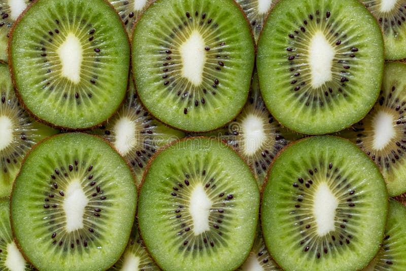 Slised Pieces of Kiwi Background Texture Stock Photo - Image of ...