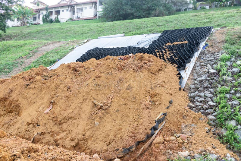 Slope Erosion Control with Grids and Earth on Steep Slope Stock Image ...