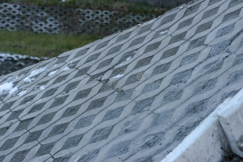 The Slope is Reinforced with Openwork Concrete Slabs. Stock Photo ...