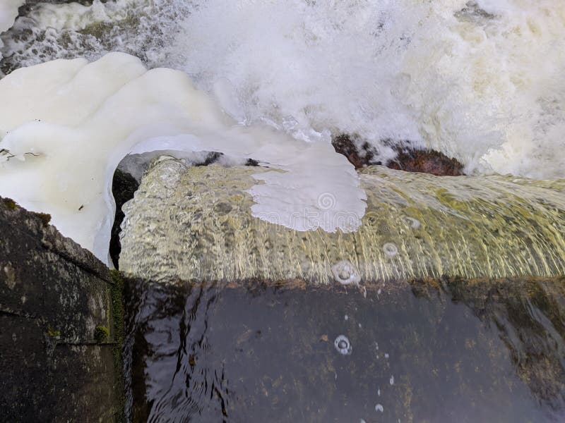 Slope of a Waterfall in Early Spring that Flows Under a Canopy of Ice ...
