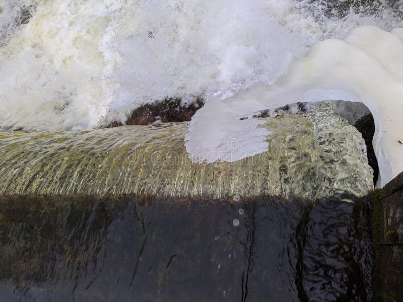 Slope of a Waterfall in Early Spring that Flows Under a Canopy of Ice ...