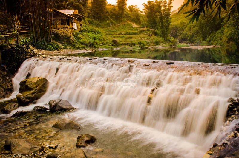 The Slope of Waterfall and Sunset Stock Image - Image of cottage, rock ...