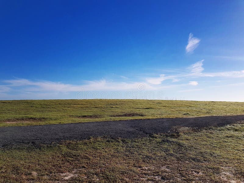 Gently Sloping Hill Against a Blue Sky Stock Photo - Image of gently ...