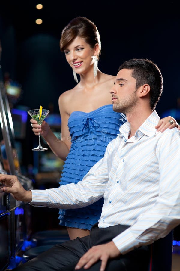 Slot Machine Playing Couple Stock Image - Image of couple, flirt: 20366977
