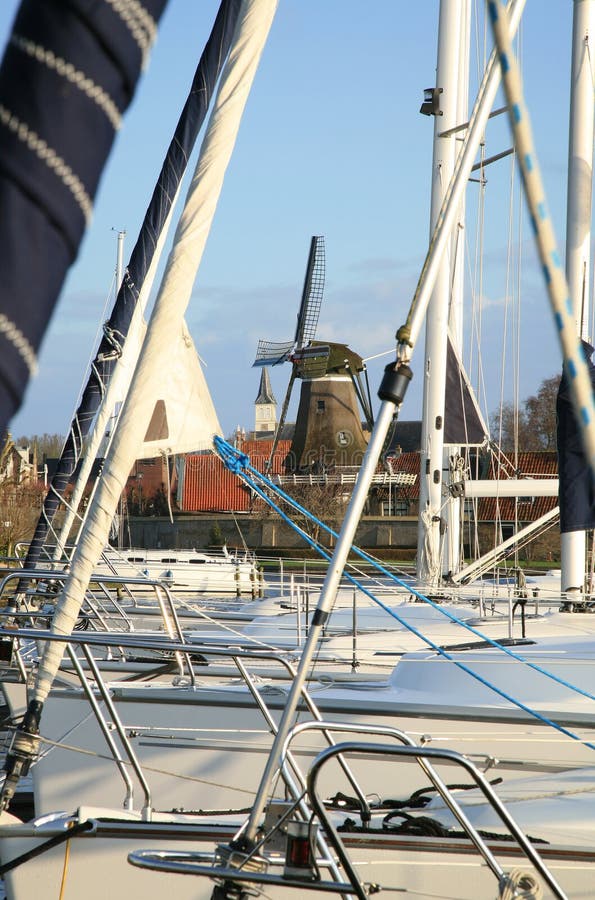 Sloten with Windmill and Sailboat. Netherlands. Stock Image - Image of ...