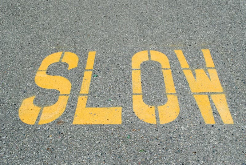Slow stock image. Image of pavement, sign, paint, street - 26549885