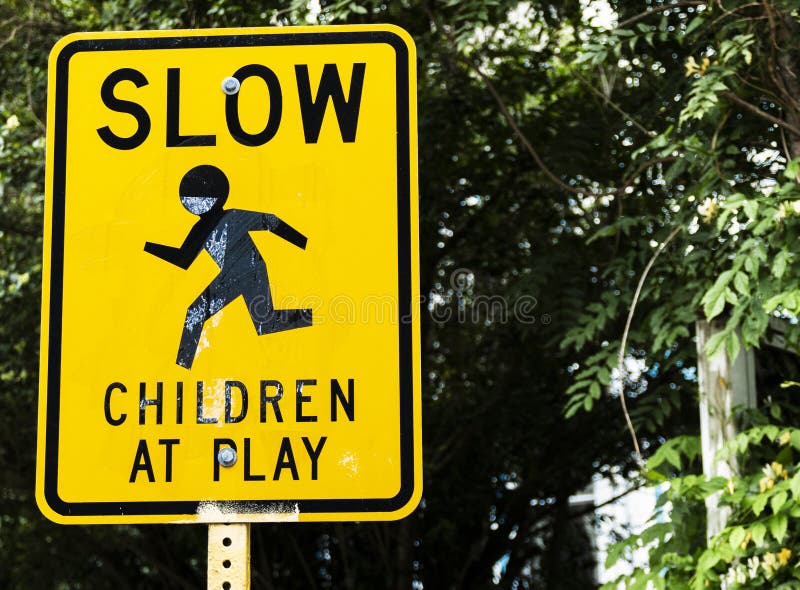 Slow Down Children at Play Sign Stock Image - Image of traffic, running ...
