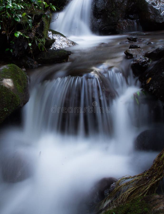 Slow flowing waterfall stock photo. Image of landscape - 58454044
