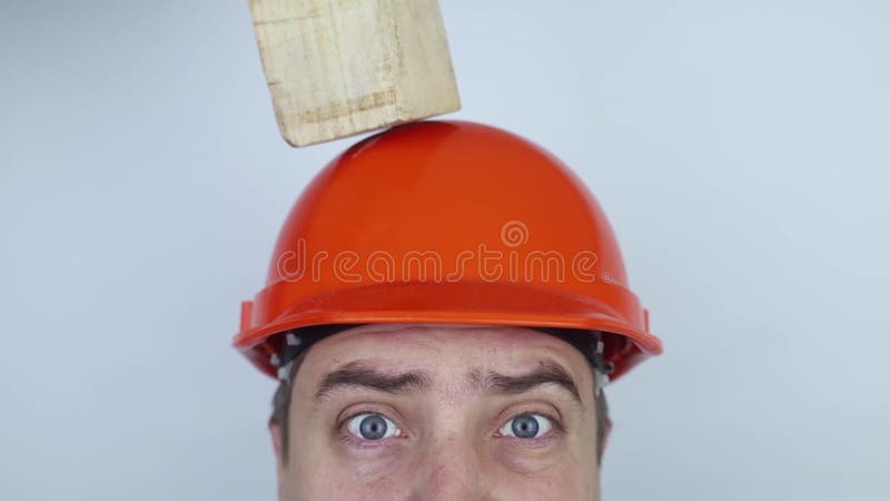 Safety Helmet. Brick and a Board Fall on Builder Head. Saving a Life ...