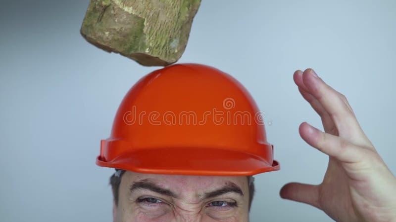 Safety Helmet. Brick and a Board Fall on Builder Head. Saving a Life ...