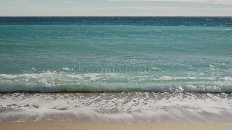 Slow Motion Blue Waves on a Sandy Empty Beach in Cannes in Spring Stock ...