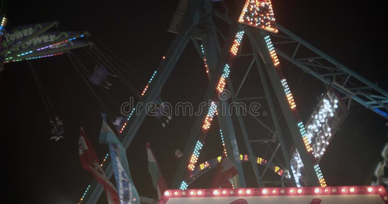Amusement Park Rides Lit Up at Night Stock Footage - Video of circle ...