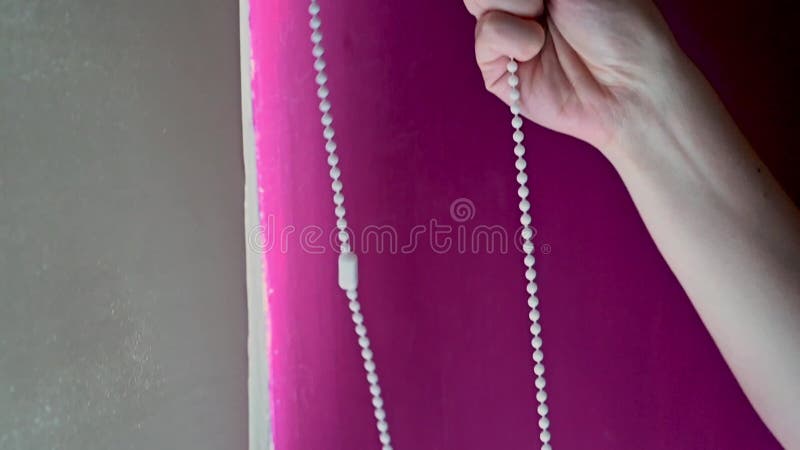 SLOW MOTION CLOSE UP of Hands Pulling Open a Roller Blind Stock Video ...