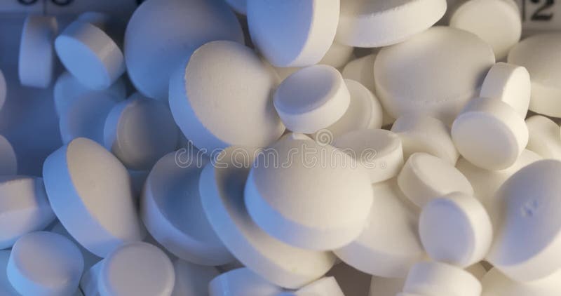 Slow Motion Falling Pills Falling on a Clinical Thermometer. Top Down ... Slow Motion Falling Pills Falling on a Clinical Thermometer. Top Down ...