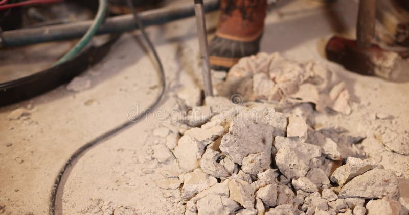 Slow Motion Footage of Construction Worker Drilling Concrete Floor ...