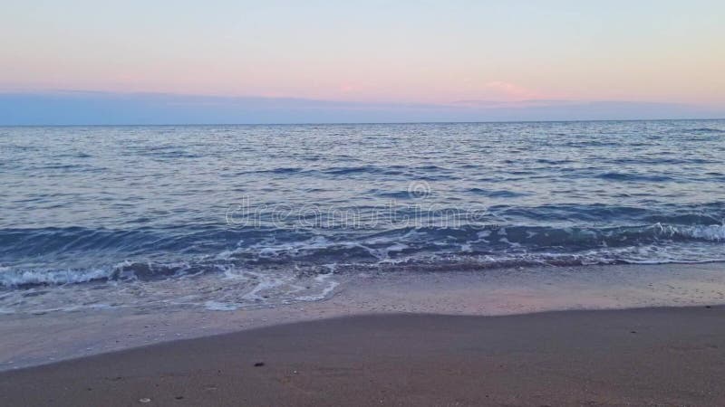Slow Motion Footage of the Dramatic Sunset Hour by the Beach. Outdoors ...