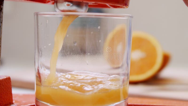 Super Slow Motion of Fresh Orange Juice Squeezed Using a Manual ...