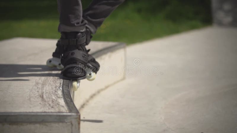 Slow Motion of a Guy Doing a Trick while Rollerblading Captured in a ...