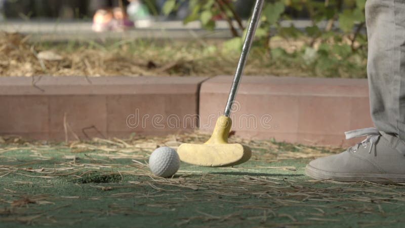 SLOW MOTION: Little Player Beats a Golf Ball To Hole Course Stock Video ...