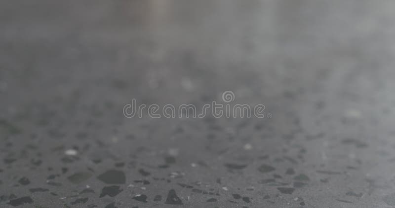 Slow Motion Man Hand Bowl Full of Macadamia Nuts on Terrazzo Countertop ...