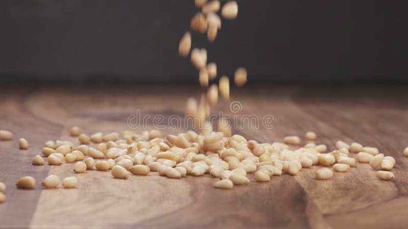 Slow Motion Pine Nuts Falling on Wood Table Stock Footage - Video of ...