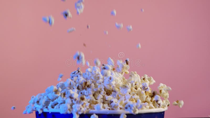 Slow Motion Popcorn Falling Inside Bag. Pink Background Stock Video ...