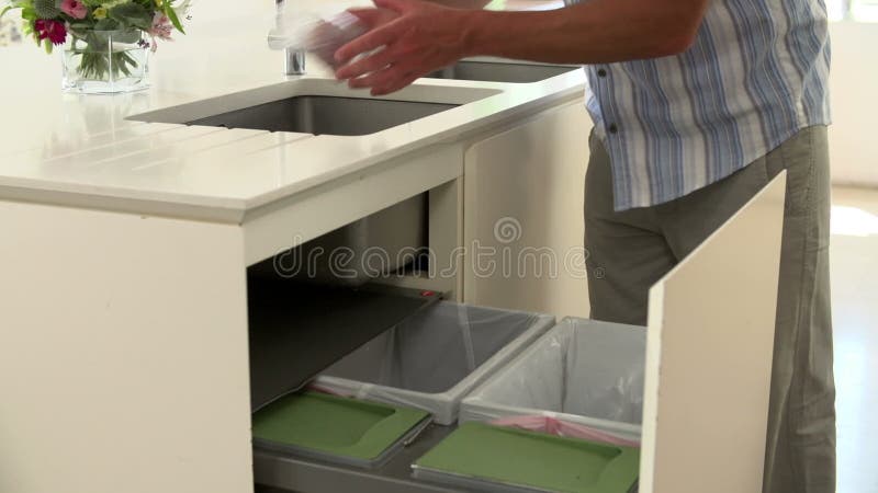 Slow Motion Sequence of Man Recycling Kitchen Waste in Bin Stock ...