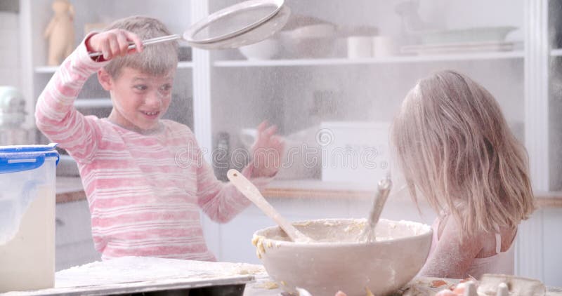 Slow Motion Shot of Children Having Messy Fun in Kitchen Stock Video ...