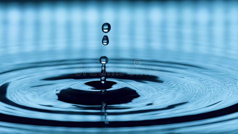 Slow-motion Shot of a Water Drop Falling into the Water and Making ...