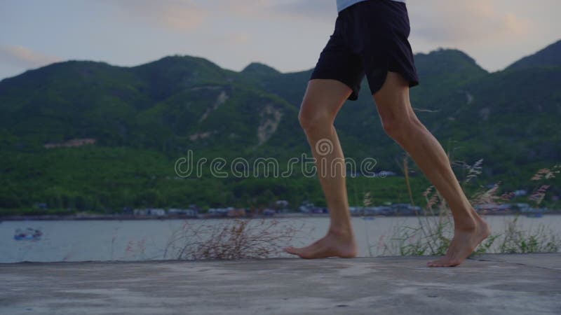 Slow Motion Shot of a Young Man Running Barefoot. Barefoot Running ...