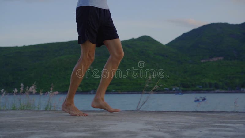 Slow Motion Shot of a Young Man Running Barefoot. Barefoot Running ...