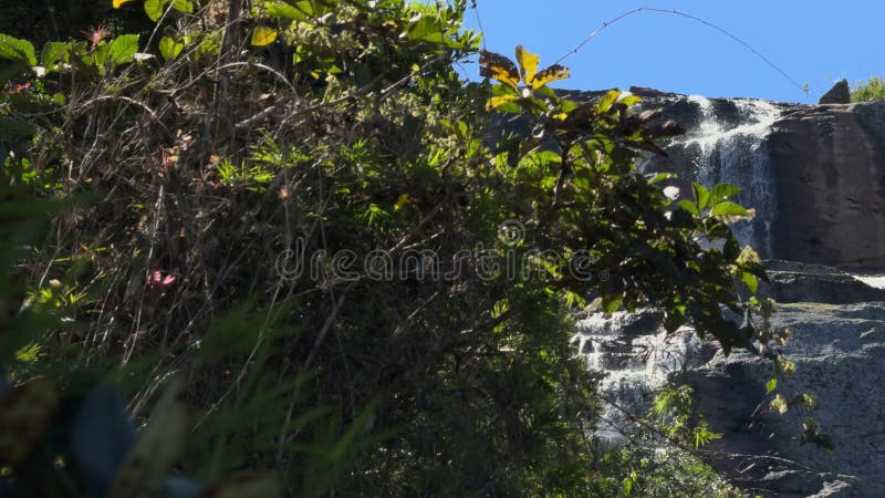 Slow Motion Slide To a Rust-Colored Multi-Level Waterfall Stock Photo ...