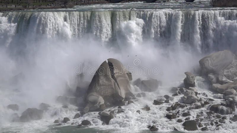 Slow Motion of a Splashing Waterfall Flowing Down the Huge Rocks Below ...