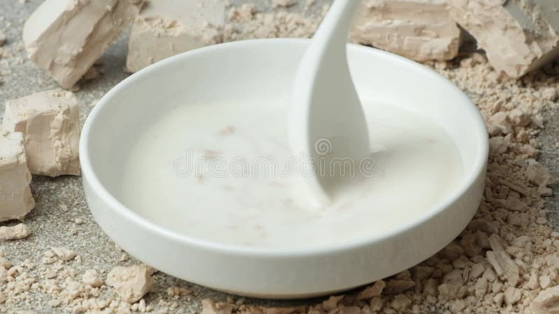 Slow Motion of Stirring with a Spoon of Wet Fresh Yeast in Warm Milk ...