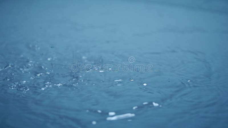 Water Dripping and Splashing in a Clear Blue Environment Stock Footage ...
