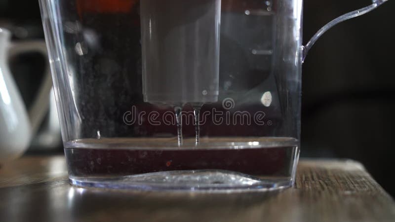Slow-motion Water Filtration through a Gravity Filter into a Plastic ...