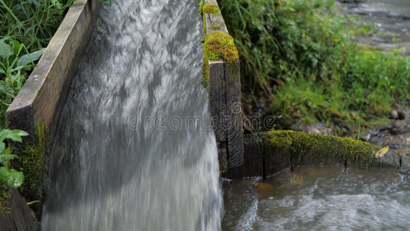 Slow Motion Water Flows through a Wooden Gutter Stock Video - Video of ...