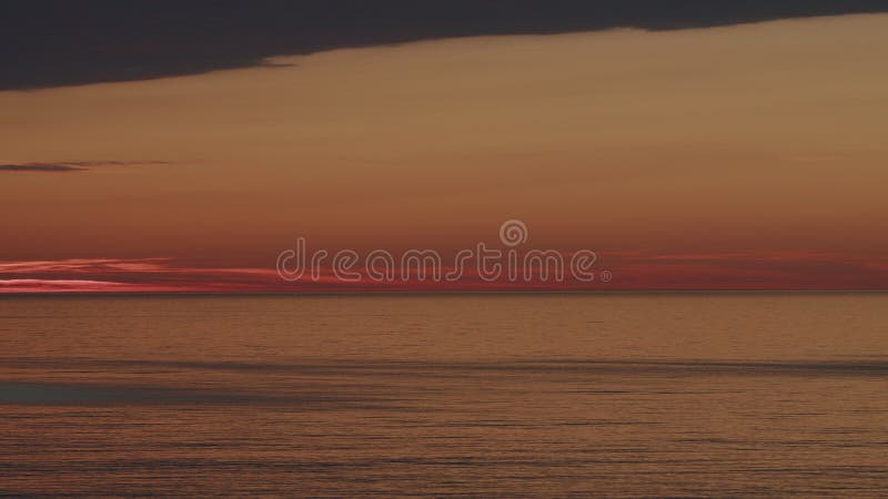 Water in Ocean with Sunset Reflected on Waves. View of Calm Waves ...