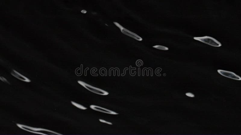 Slow Motion Water Surface Texture Splash, Waves and Ripples on Black ...