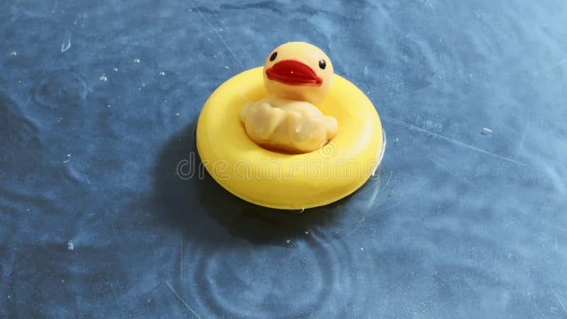 Slow-motion of a Yellow Rubber Duck Falling on Water and Making Splash ...