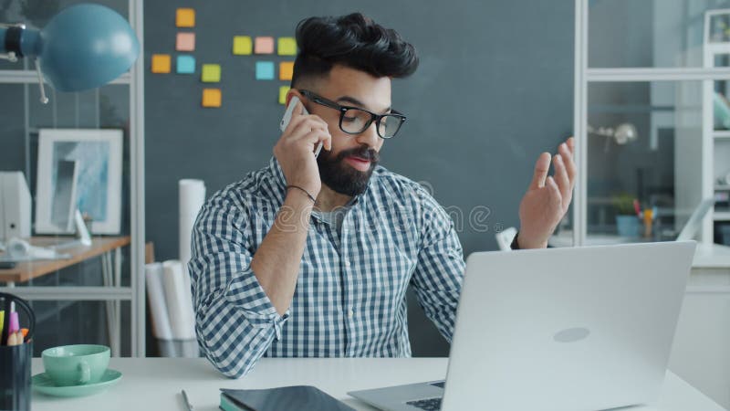 Slow Motion of Young Middle Eastern Man Speaking on Mobile Phone in ...