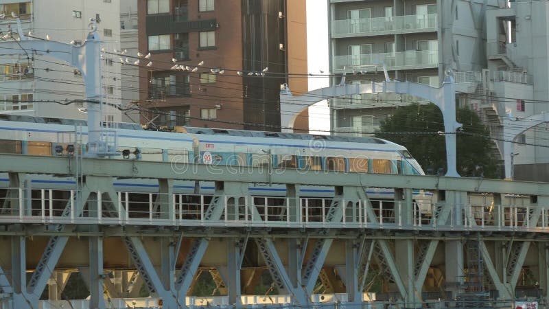 A Slow Moving Train on the Tracks of Tokyo Japan Stock Footage - Video ...