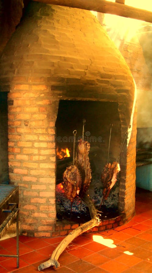 Slow Roast Meat Colombian Style Stock Photo - Image of fireplace, light ...