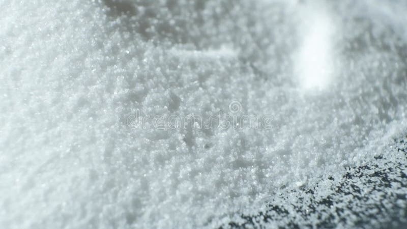 Slow Rotation of Finely Ground White Rock Salt, Black Background Stock ...