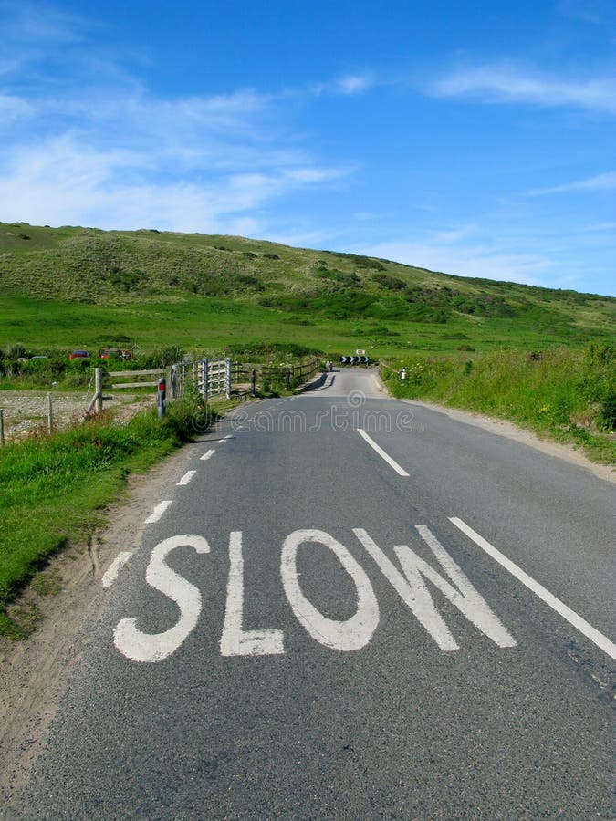 Slow Sign on an English Road. Stock Image - Image of scenic, sign: 5391585