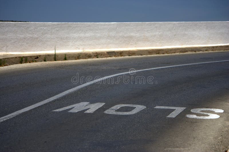 Slow sign on the road stock photo. Image of bushes, poles - 16499590
